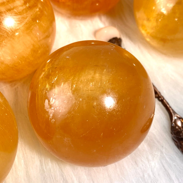 honey calcite sphere – MillionCrystal